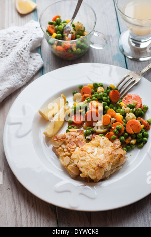 Poznan, Poland, fish breaded with almonds vegetables Stock Photo - Alamy