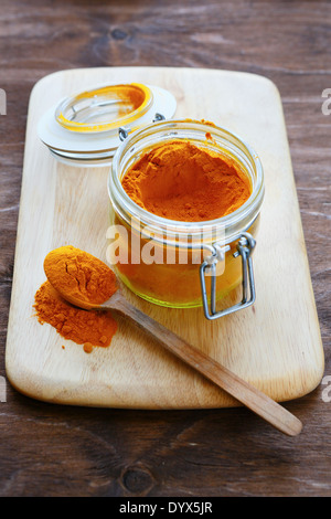 ground turmeric in a glass jar Stock Photo - Alamy