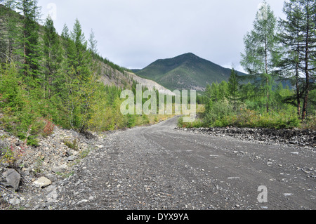 Cloudy landscape on a route Yakutsk - Magadan. Russia. Wooden bridge in ...