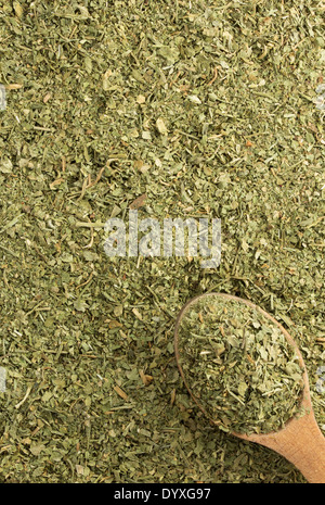 Spice dried dill or basil in the form of green powder. Asian cuisine ...