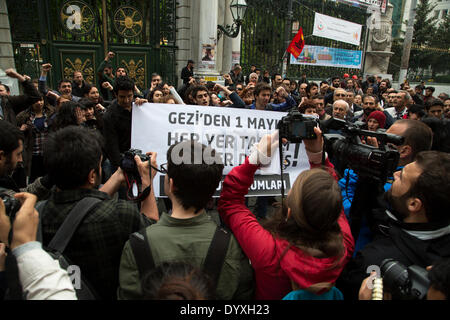 Istanbul, Turkey. 1st May, 2014. Demonstrators take cover as riot ...
