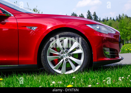 Red Tesla Model S P85, a luxury electric car Stock Photo - Alamy