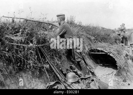 German soldier in an anti-tank ditch on the Atlantic Wall north of Caen ...