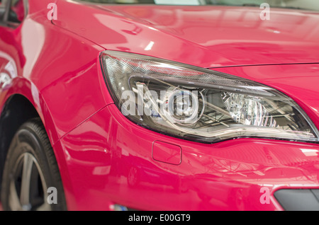 Car headlamp. Part of car at dealership salon Stock Photo - Alamy