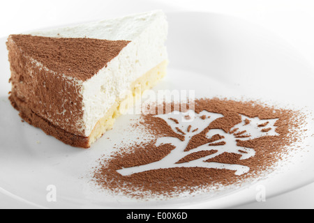 Peace of cake on white dish and white background Stock Photo - Alamy
