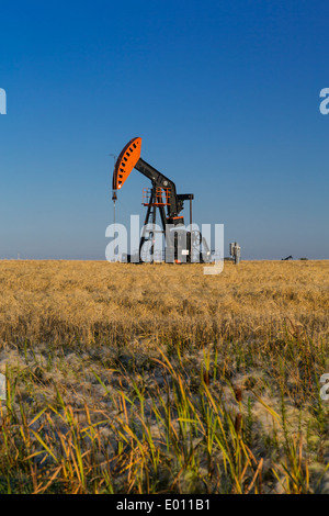 An oil pumper in the Bakken play oil fields near Williston, North ...