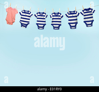 baby clothes on a background Stock Photo - Alamy