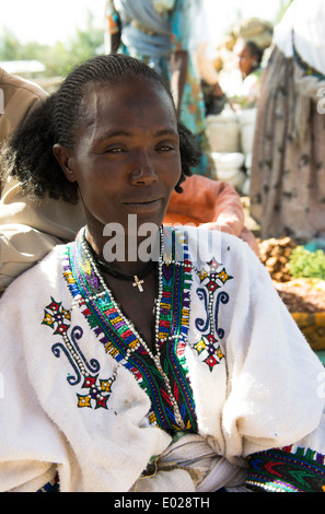 A beautiful Tigrinya woman dressed in a traditional TIgray dress at the ...