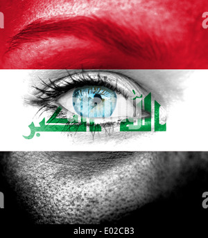 Human face painted with flag of Iraq Stock Photo - Alamy
