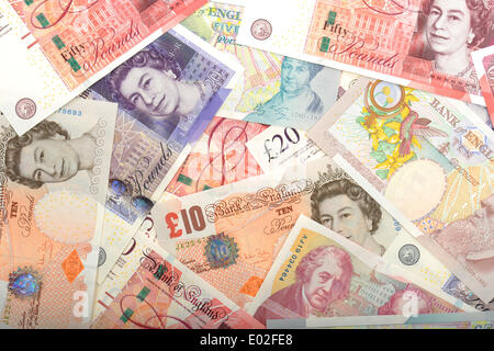 Currency banknotes spread across frame british pound sterling in ...