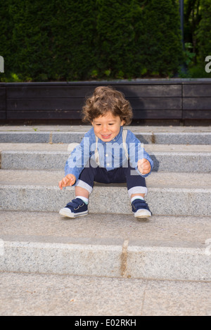Boy going up stairs Stock Photo - Alamy