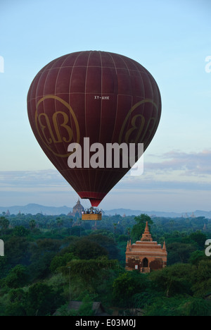 A sight-seeing hot air balloon rises up above the famed ancient temple ...