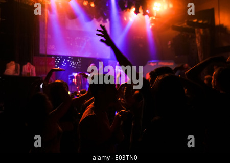 Beautiful dreamy colourful image of a nightclub interior with people ...