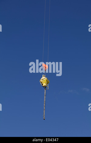 A cement, concrete or mortar hopper being transported by a construction ...