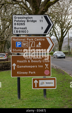 Road signs and a brown tourist information sign in Leicestershire, uk ...