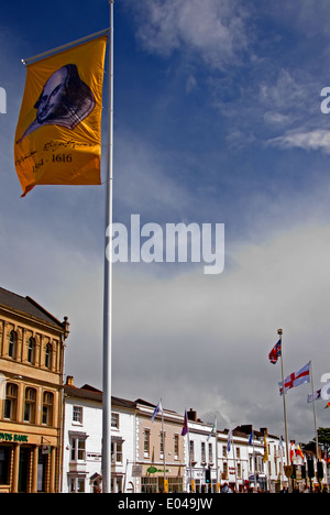 Face of William Shakespeare on a yellow flag against a blue sky as part ...