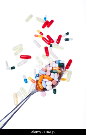 A lot of colored pills and tablets over a white background Stock Photo ...