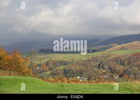 Plane flying over Moffat golf course Stock Photo - Alamy