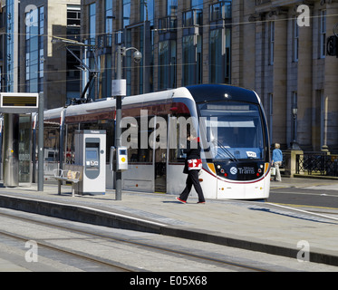 Tram platform on St. Andrew Square, Edinburgh with Harvey Nichols store ...