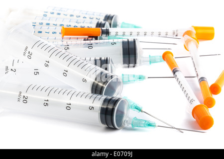 different types of surgical syringes isolated ove a white background ...