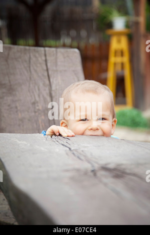 Blond child, toddler boy, playing with plastic animal toys at home ...
