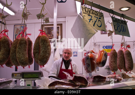 A butcher sells meat at Luciano's meat stand in the Mercato Centrale di ...