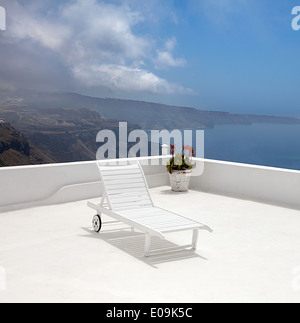 Pot with flower on terrace with sea view Stock Photo - Alamy