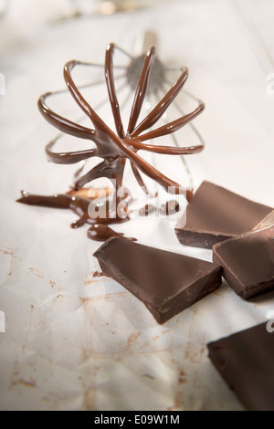 Bar of chocolate and egg beater Stock Photo - Alamy
