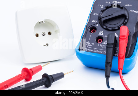 Plug socket and multimeter Stock Photo - Alamy