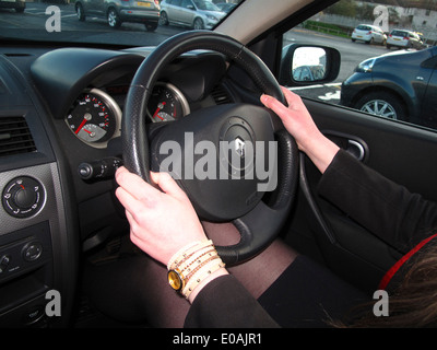 17 Year old girl driving car in school uniform Stock Photo - Alamy