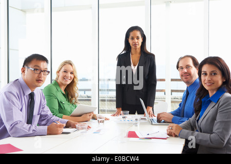 Smiling businesswoman conducting meeting in coworking office Stock ...
