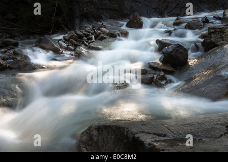 Abstract motion blur of water falling over rock formations at Great ...
