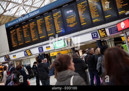 Time-table and departure board at Victoria Train Station Stock Photo ...
