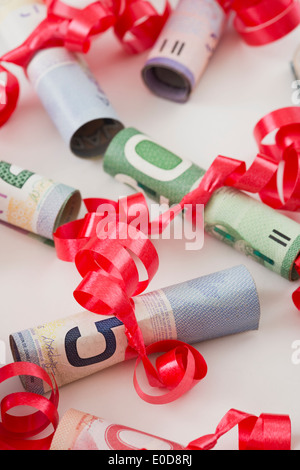 A twenty dollar bill rolled up and placed inside a clear prescription ...