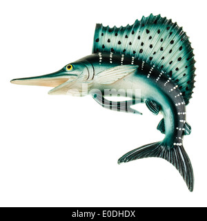 a small swordfish fridge magnet made in plastic and isolated over white ...