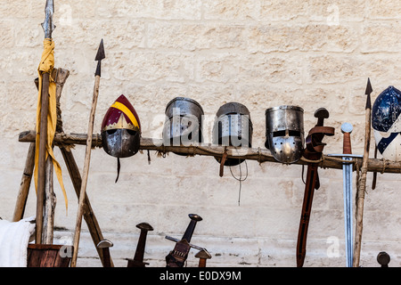medieval shields, helm and weapons in a medieval fair in italy Stock ...