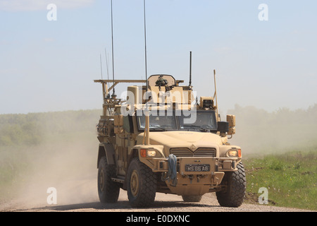 British Army Husky protected support vehicle traveling over rough ...