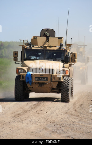 British Army Husky protected support vehicle traveling over rough ...
