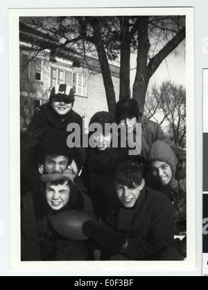 This photograph captures a historical football team, possibly from the ...