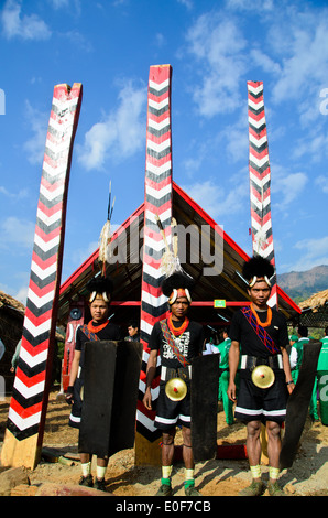Naga men in tribal dress playing musical instrument, Hornbill Festival ...