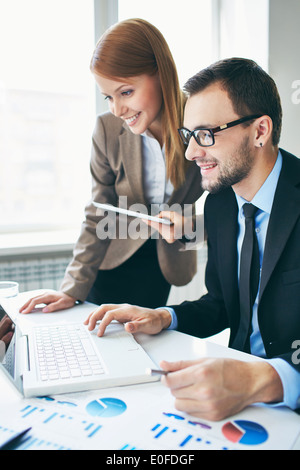 Two successful business partners working at meeting in office Stock ...