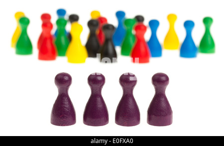 Four blue pawns in front of a large group of different colored pawns ...