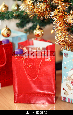 Gift boxes under Christmas tree, New Year home decorations, red ...