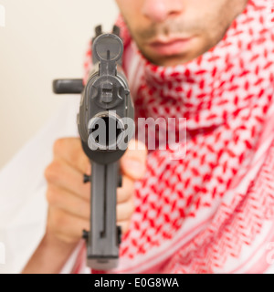 Arab adult with a machine gun, terrorist, isolated on white Stock Photo ...