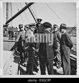 A German officer reports to the Reichskommissar during World War II ...