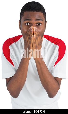 Nervous football fan looking ahead in a large football stadium with ...