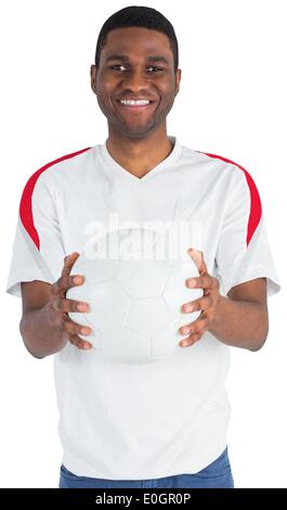 Handsome football fan looking at camera Stock Photo - Alamy