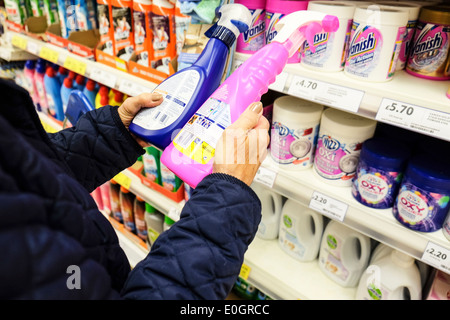 A shopper comparing two products Stock Photo - Alamy