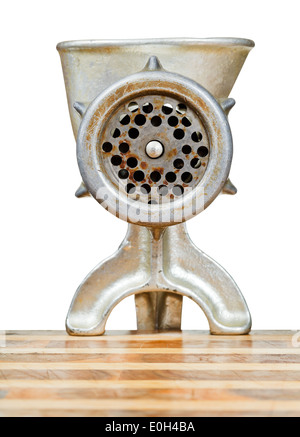 old iron meat mincer mounted on table isolated on white background ...