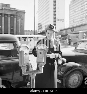 This 1961 photo shows a ‘meter maid’ in Stockholm, a woman employed to ...